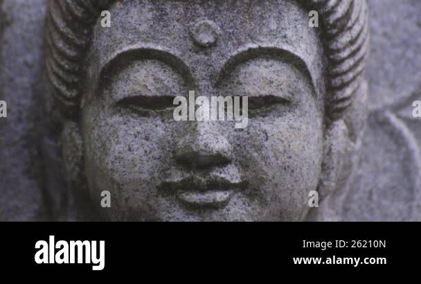 A buddhism stone statue at Japanese temple. High quality 4k footage ...