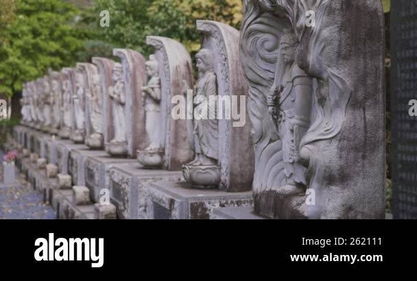 A buddhism stone statue at Japanese temple. High quality 4k footage ...