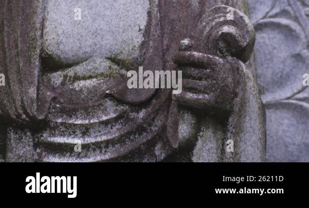 A buddhism stone statue at Japanese temple. High quality 4k footage ...