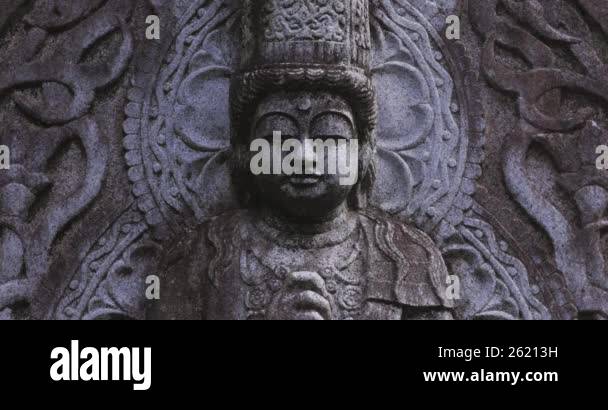 A buddhism stone statue at Japanese temple. High quality 4k footage ...