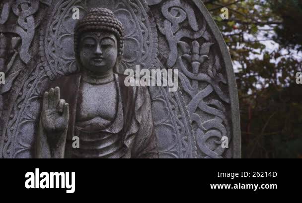 A buddhism stone statue at Japanese temple. High quality 4k footage ...