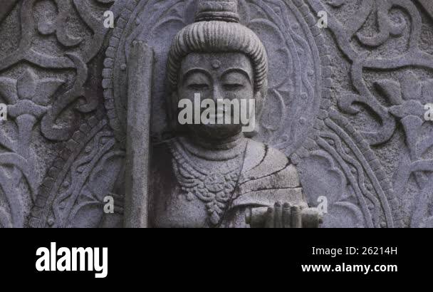A buddhism stone statue at Japanese temple. High quality 4k footage ...