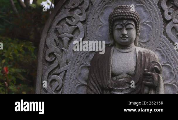 A buddhism stone statue at Japanese temple. High quality 4k footage ...