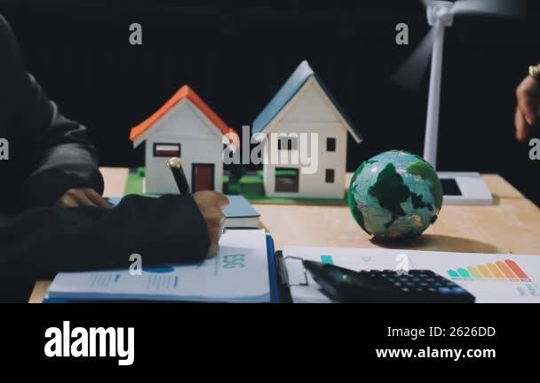real estate agent showing model of house model, real estate concept ...