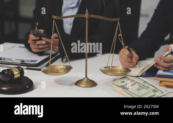 lawyer or lawyer or lawyer or judge working at the office. gavel, money ...