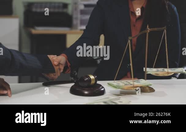 woman and businessman are shaking hands to corruption. bribery ...