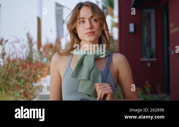 Cute lady posing street with sweater on shoulders closeup. Portrait ...
