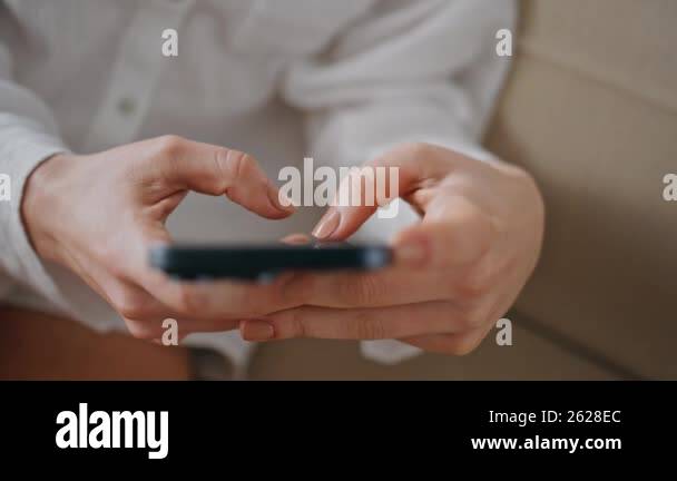 Closeup woman hands texting smartphone indoors. Female fingers touching ...