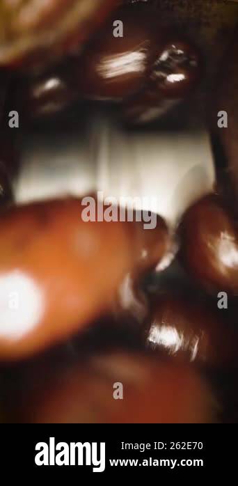 Macro shot coffee beans slow motion grinding machine to make coffee ...