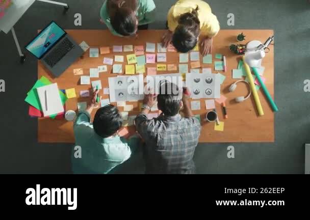 Time lapse of business team put graphic logo on meeting table with ...