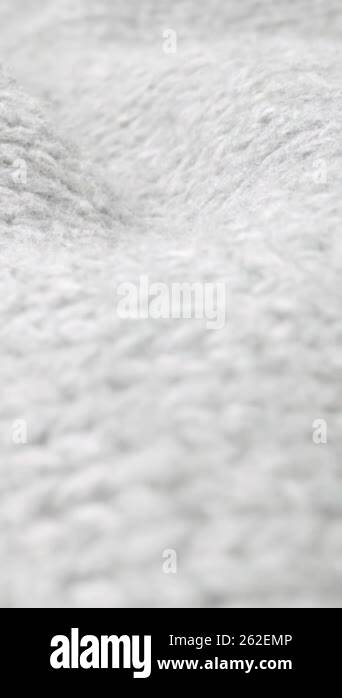 Extreme detail view of sheep wool cloth texture in macro dolly shot ...