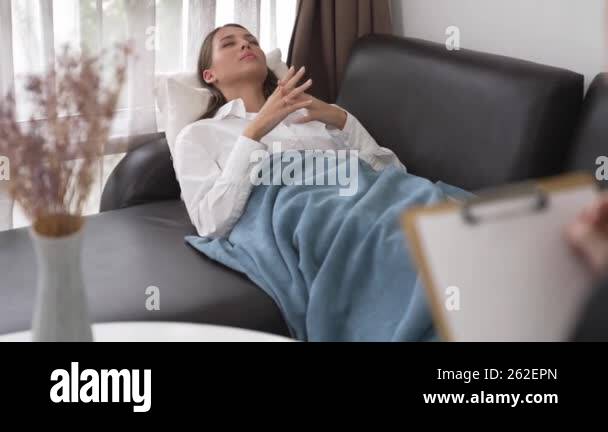 Young female patient lying on crouch release emotion from traumatic ...