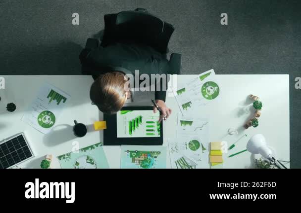 Top view of smart manager making decision about green business ...