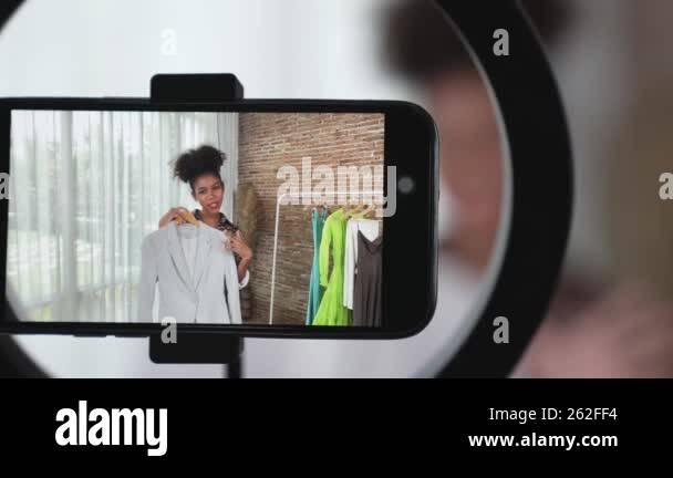 Woman influencer shoot live streaming vlog video review clothes crucial ...