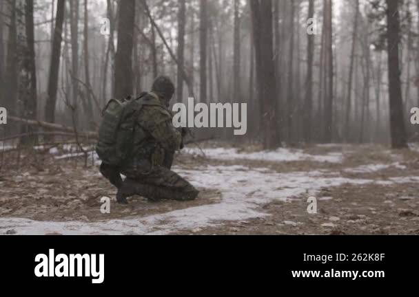 Special forces in forest. Armed reconnaissance soldier in winter forest ...