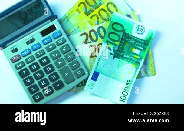 Milan, Italy 1 January 2025: Accountant is adding euro banknotes on a ...