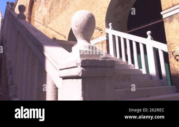 Treviso, Italy 1 January 2025: Tourists walking up old stone stairs ...