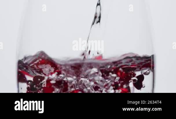 Pure water is added to a glass container, capturing simplicity and ...