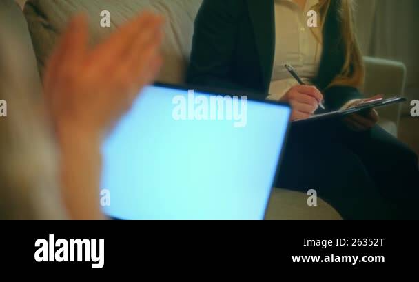 Close-up view of a womans hand gestures during a business meeting ...