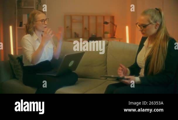 A female business coach supports her client by discussing development ...
