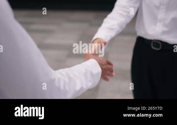 Close up multiethnic women handshake shaking hands contract deal agree ...