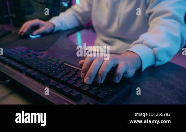 Caucasian man male guy gamer streamer typing laptop enjoying gaming ...