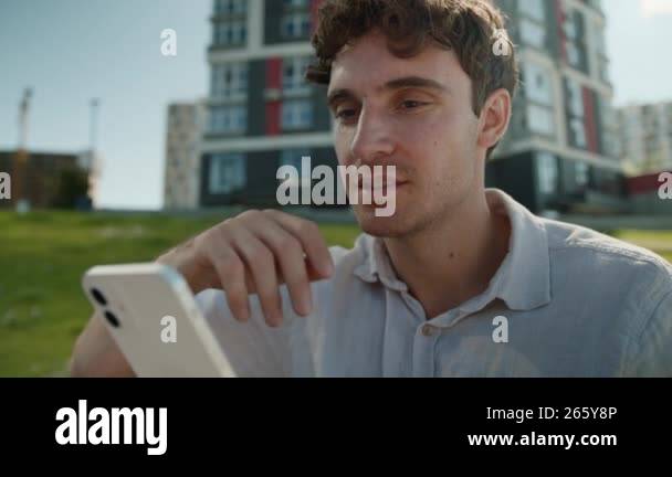 Caucasian man looking at screen mobile phone smartphone cellphone ...