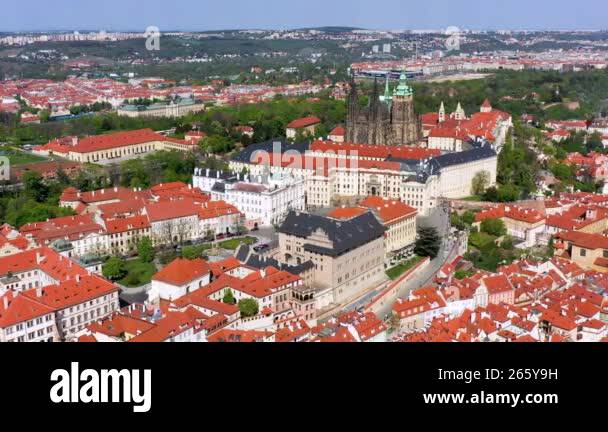 A breathtaking view of Prague showcases the iconic castle, red rooftops ...