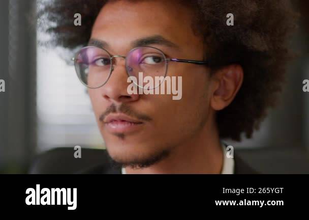 Portrait close up serious dreaming calm African American ethnic ...