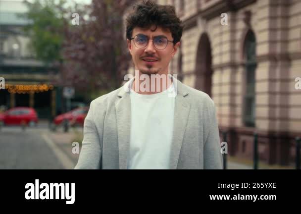 Happy smiling positive satisfied male Hispanic man guy outside in city ...