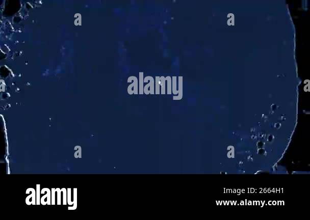 Movement of liquid or water on a plain background on a transparent ...