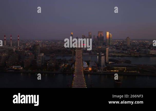 Aerial view of Queensboro Bridge showcases the illuminated skyscrapers ...