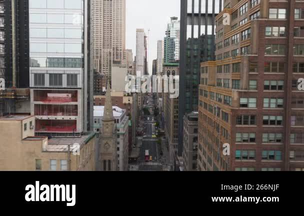 Aerial views capture a lively New York City street, with cars and ...