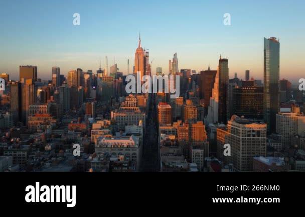 Warm sunlight envelops New York Citys skyscrapers of Midtown Manhattan ...
