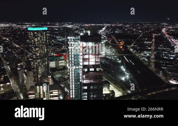 Top of a modern residential skyscraper, revealing illuminated rooms ...