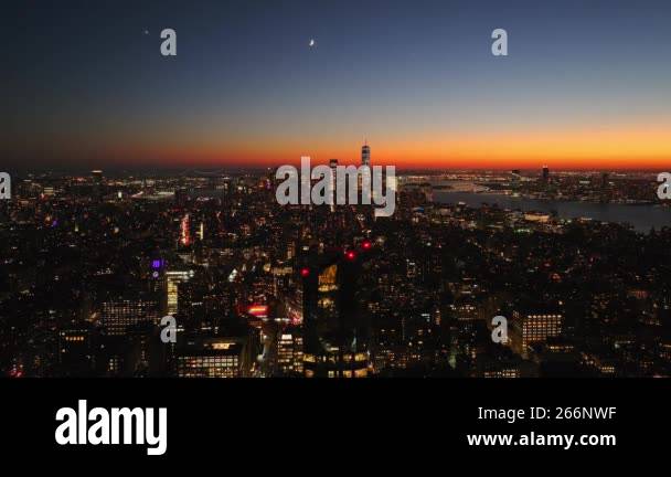 Crescent moon rises over Midtown Manhattan, New York City. Lights of ...