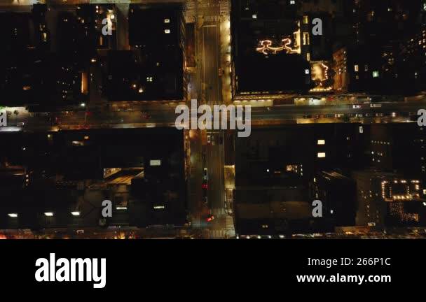 Camera moving forward over a dark Manhattan street intersection in New ...