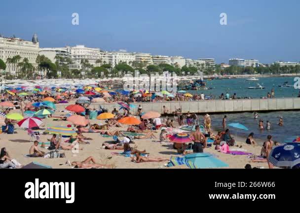 Cannes, France - October 15, 2024: People swimming and relaxing on the ...