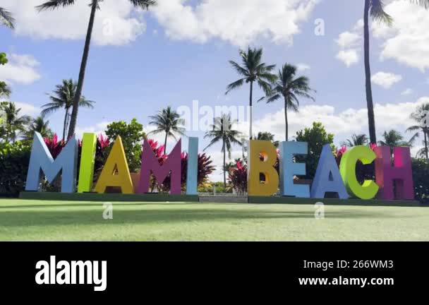 This vibrant video showcases a sunny Miami beach day with colorful ...
