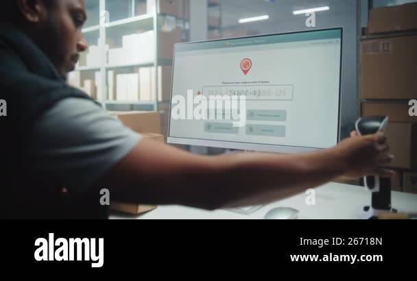African American Warehouse Associate Scans Code on Cardboard Box with Barcode Scanner, Checks ...