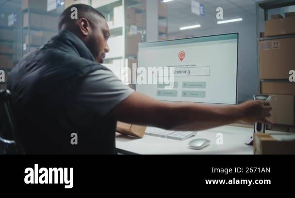 African American Postal Warehouse Worker Scans Code on Cardboard Box with Barcode Scanner ...