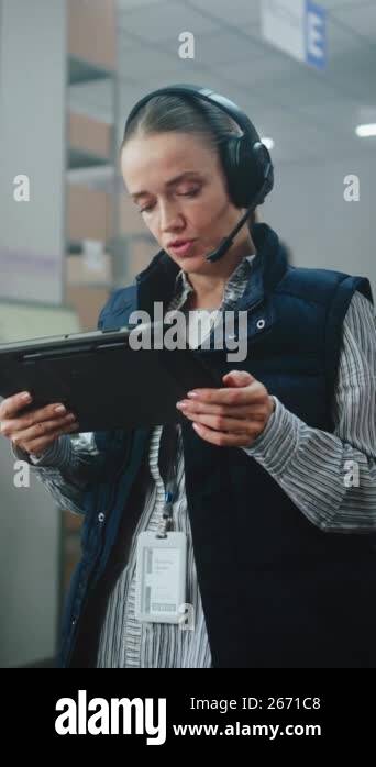 Female Logistics Coordinator, Manager in Headset Chats to Customer ...