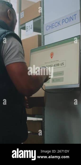African American Parcel Processing Specialist Scans Cardboard Box at ...
