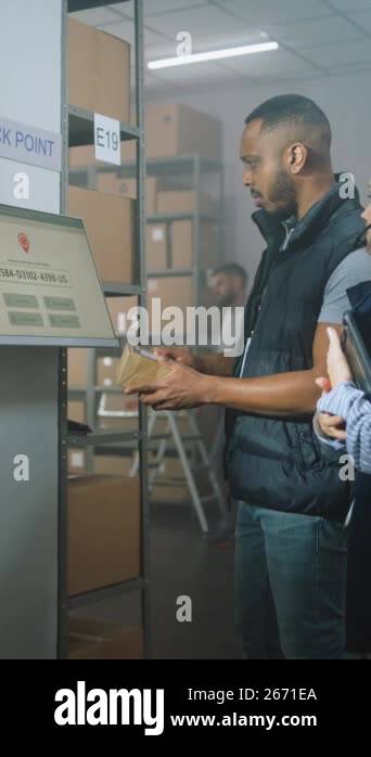 Warehouse Facility: Female Logistics Manager Uses Tablet Computer ...