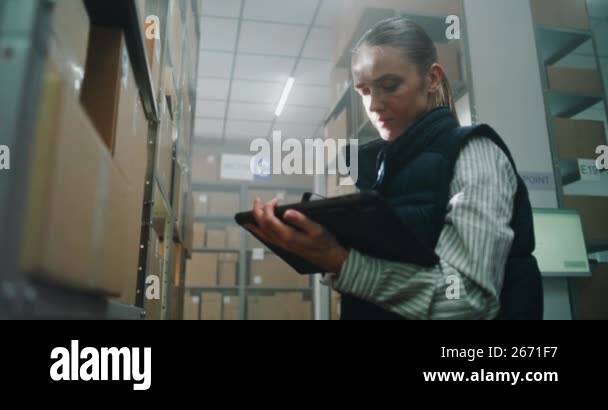 Female Sorting Center Employee Scans Parcel with Online Orders, Checks ...