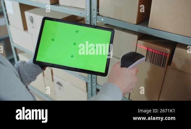 Inventory Manager Scans Code on Cardboard Box with Scanner, Checks ...