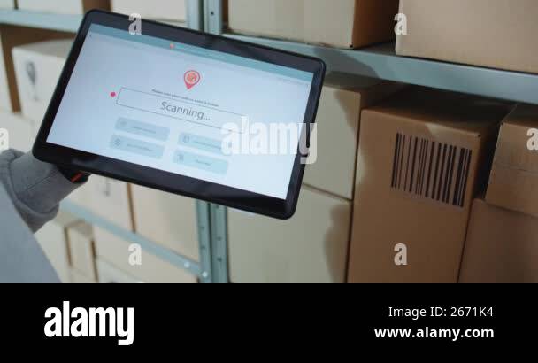 Postal Warehouse Associate Scans QR Code on Cardboard Box with Barcode Scanner, Checks Parcel ...