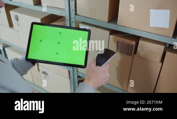 Postal Warehouse Worker Scans Code on Cardboard Box with Barcode ...