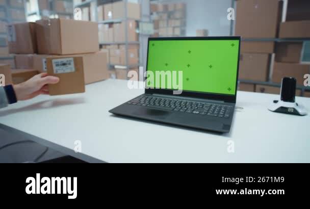 Postal Warehouse Associate Scans Code on Cardboard Box with Barcode ...