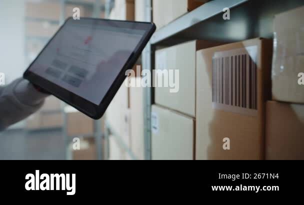 Inventory Manager Scans Code on Cardboard Box with Barcode Scanner, Checks Parcel Information ...